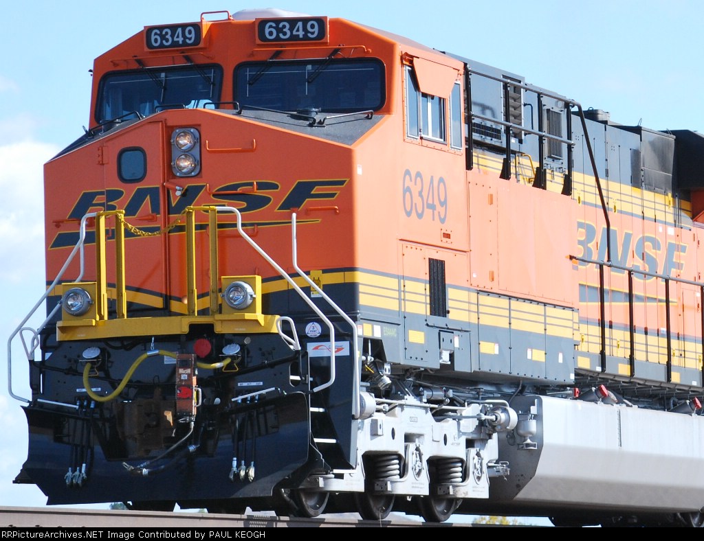 A Very close up in the sun shot of a brand new ES44AC BNSF 6349